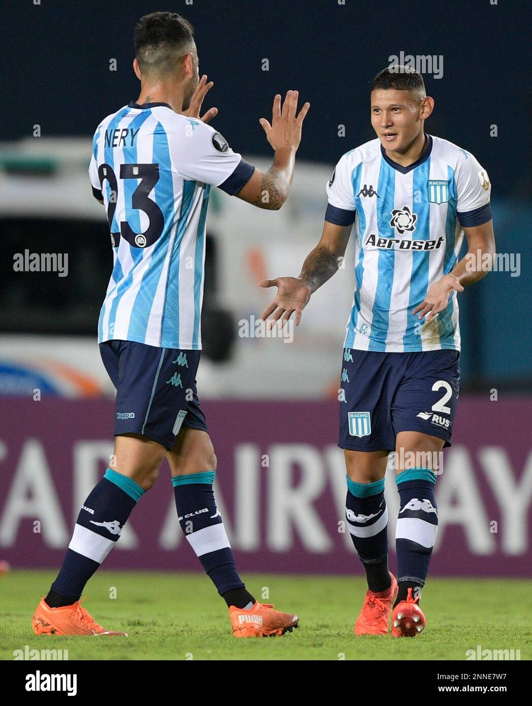 Juan Caceres of Argentina's Racing Club, right, celebrates with his ...