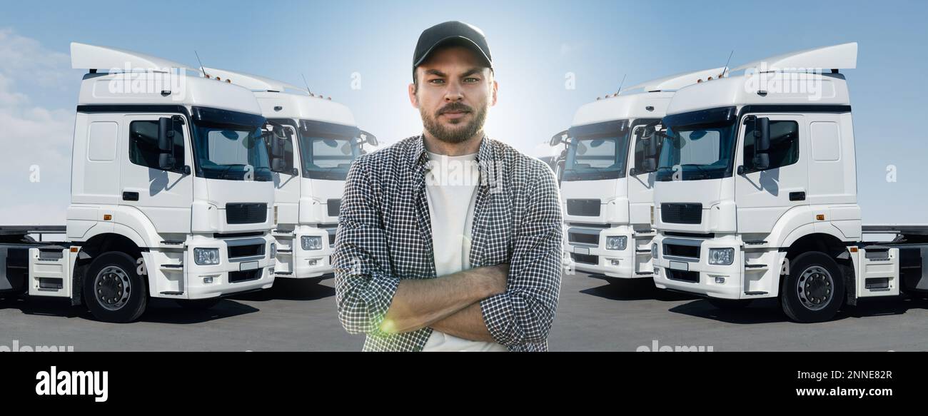 Truck driver standing in front of trucks Stock Photo - Alamy