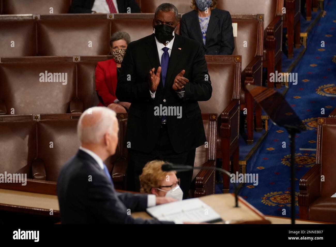 Defense Secretary Lloyd Austin applauds as President Joe Biden speaks ...