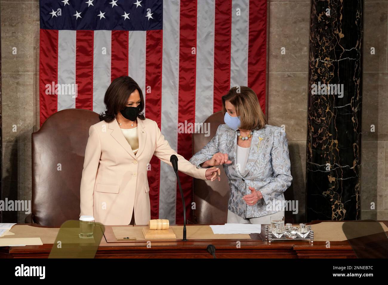 Vice President Kamala Harris elbow bumps House Speaker Nancy Pelosi of ...