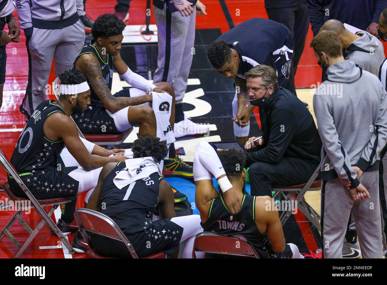 Minnesota Timberwolves coach Chris Finch talks to playeors during a ...