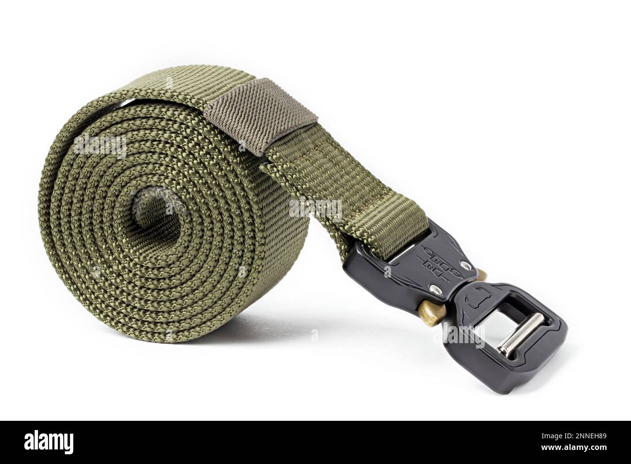 The military fabric belt with fastening is twisted. Isolated on white ...