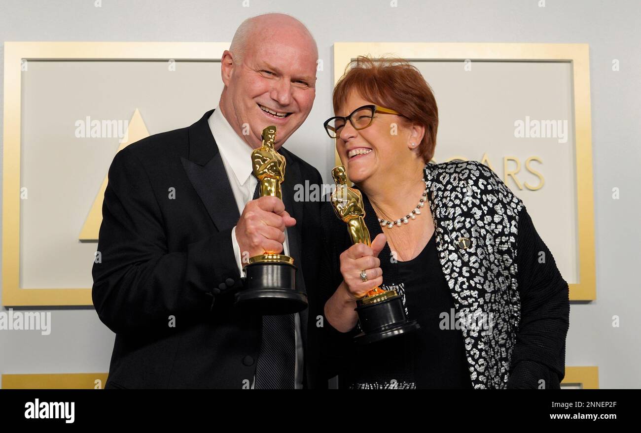 Donald Graham Burt, left, and Jan Pascale pose in the press room with ...