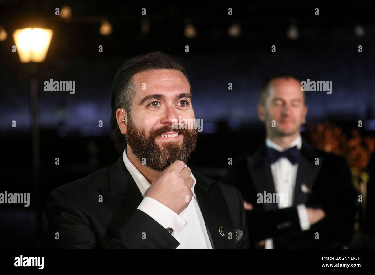 Tomm Moore, left, and Ross Stewart watch a live link of the Oscars as ...