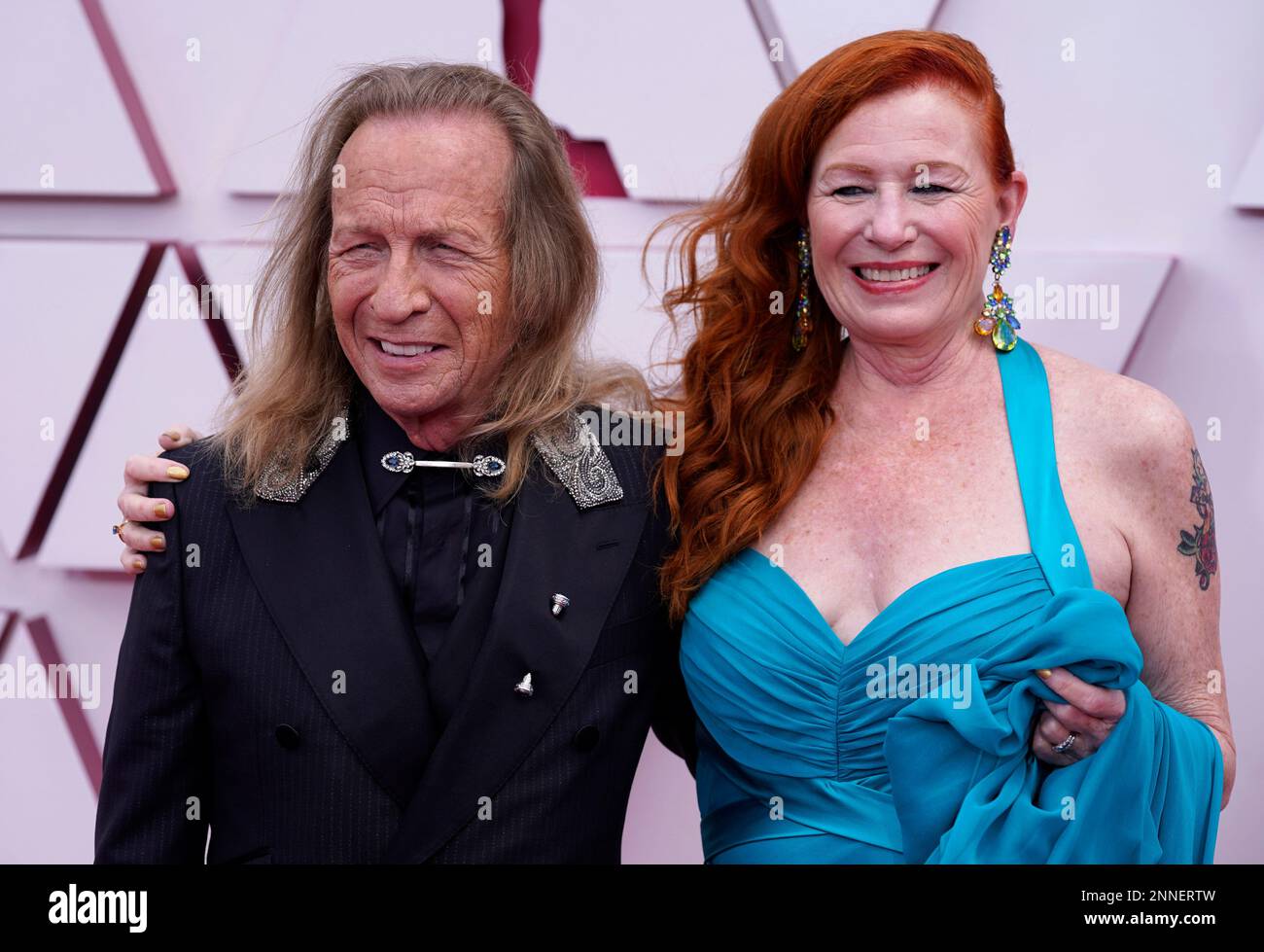 Paul Raci, left, and Liz Hanley Raci arrive at the Oscars on Sunday ...