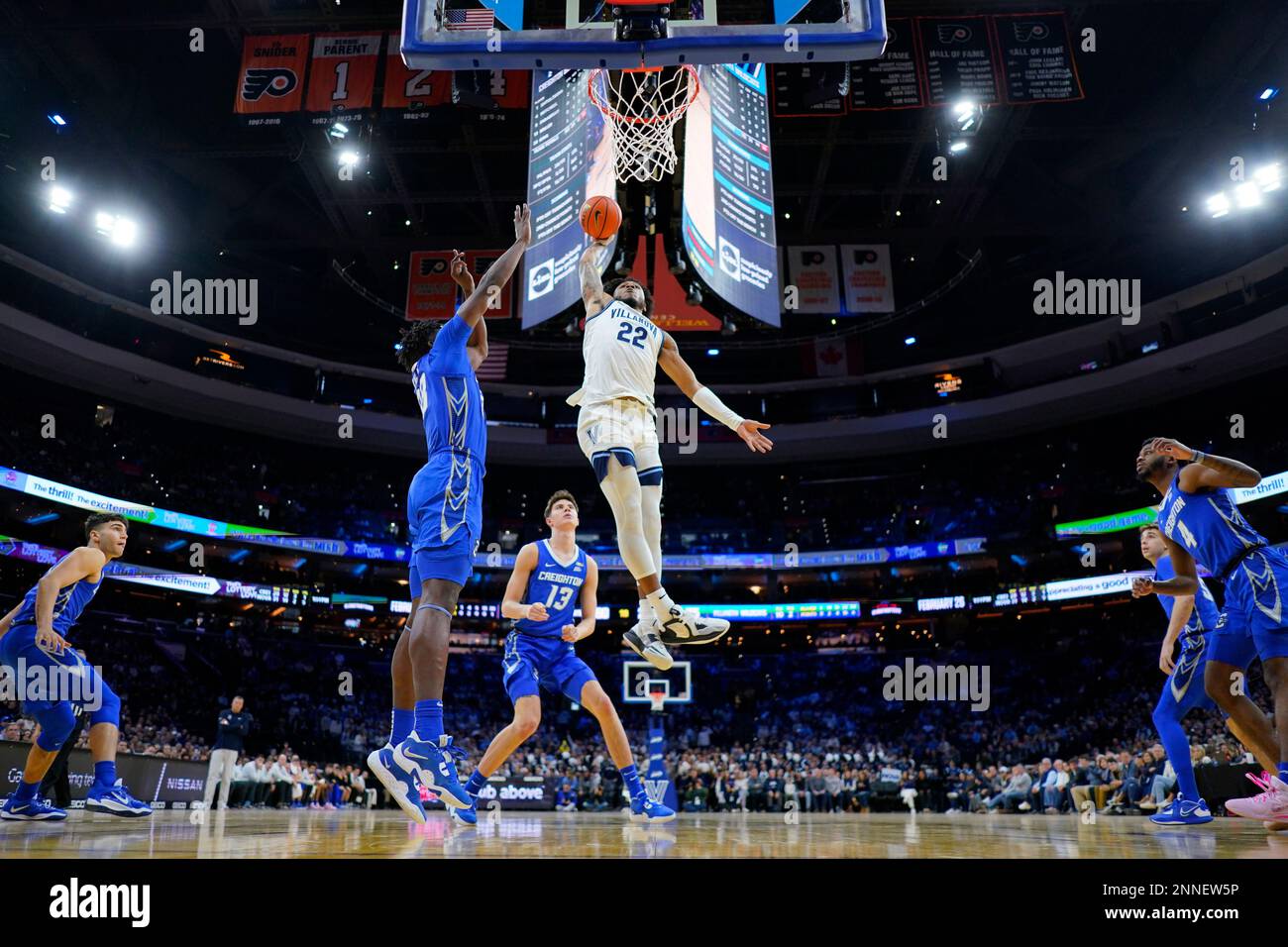 Villanova's Cam Whitmore, right, goes up for a dunk past Creighton's ...
