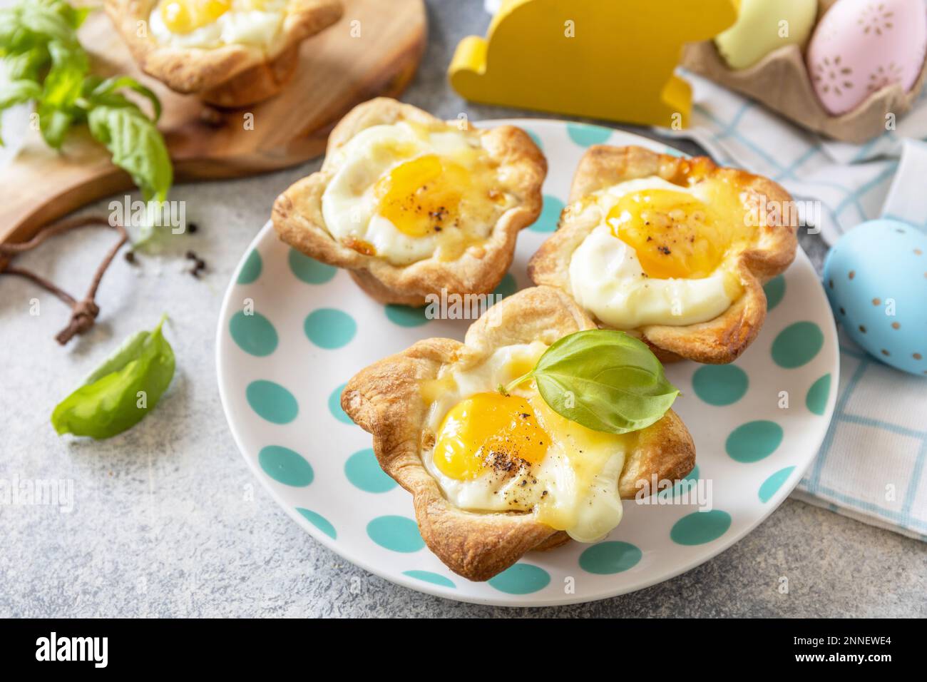 Easter breakfast idea. Scrambled eggs in puff pastry with cheese and ...