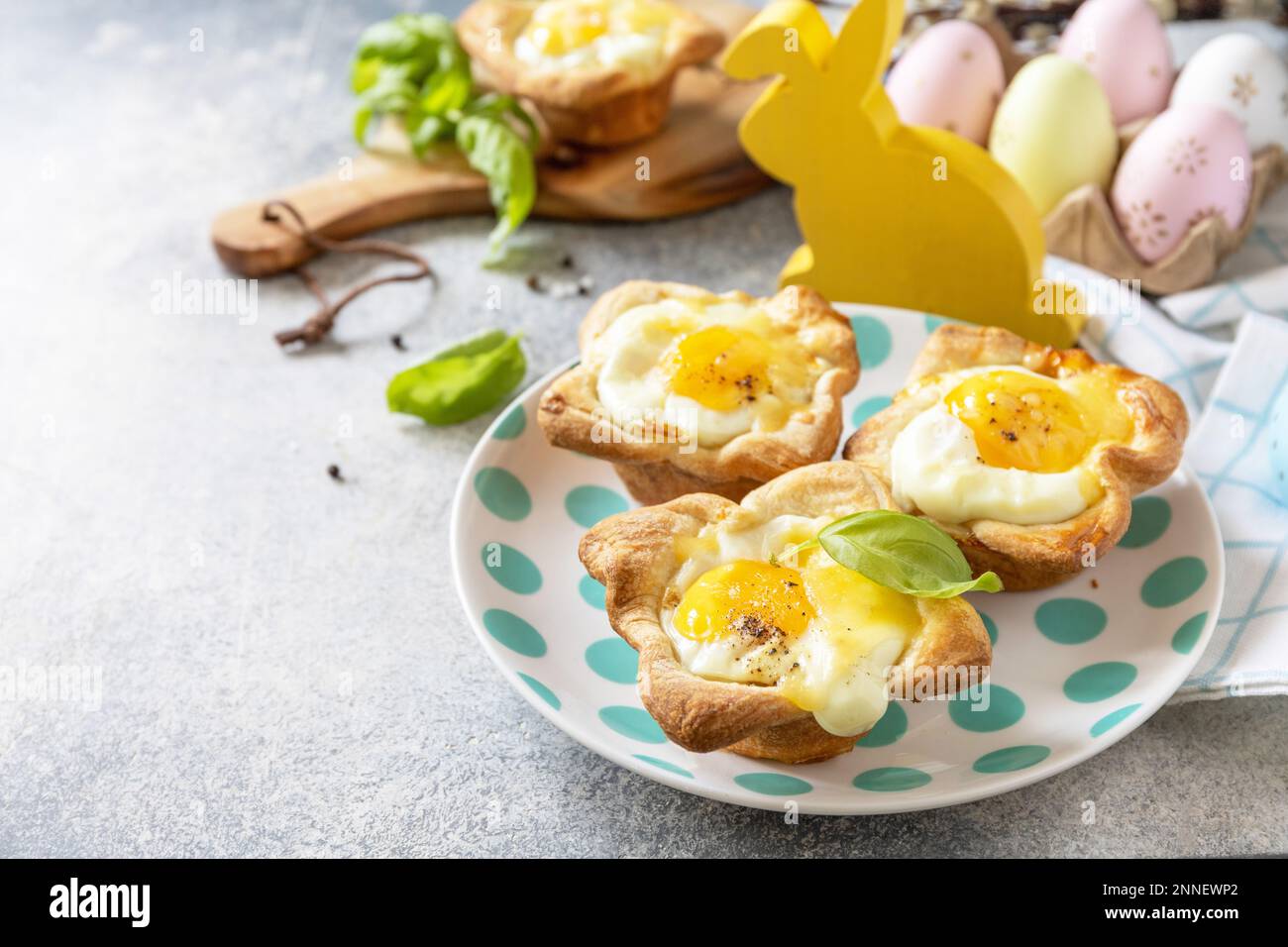 Easter breakfast idea. Scrambled eggs in puff pastry with cheese and ...