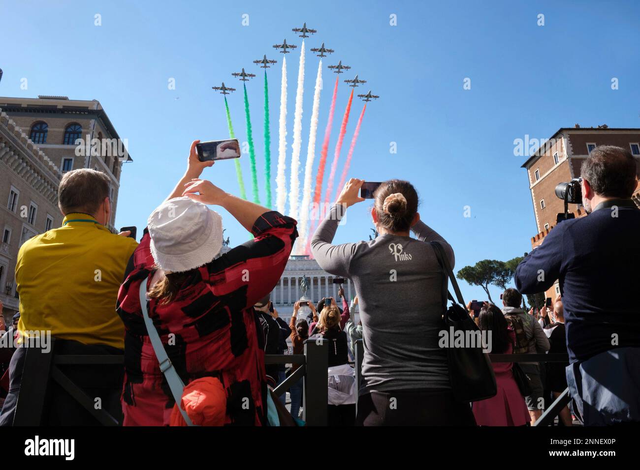 People take pictures of the Italian air-force aerobatic squad flying ...