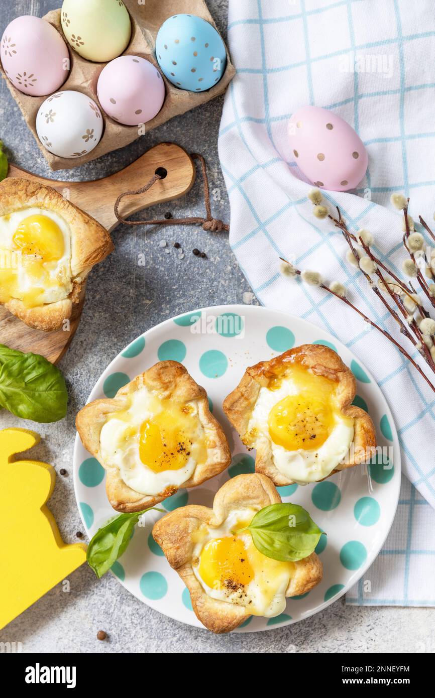 Easter breakfast idea. Scrambled eggs in puff pastry with cheese and ...