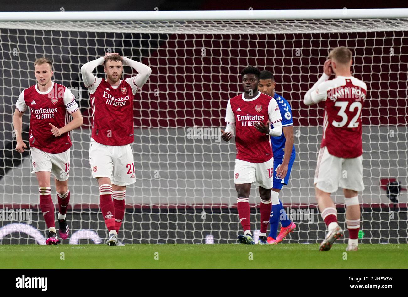 Arsenal's Calum Chambers, second left, reacts after missing a chance to ...