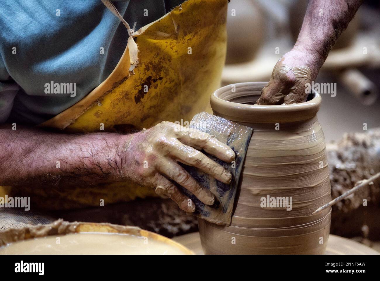 Billy Joe Craven throws a pot at his wheel Wednesday, April 14, 2021 ...