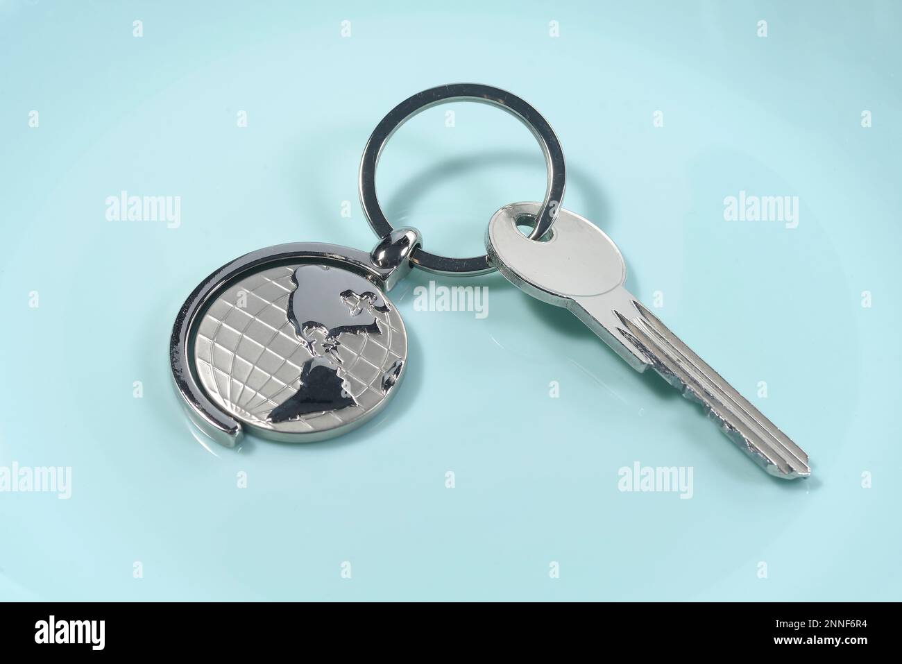 World symbol with silver keys on a blue background. Open world concept ...