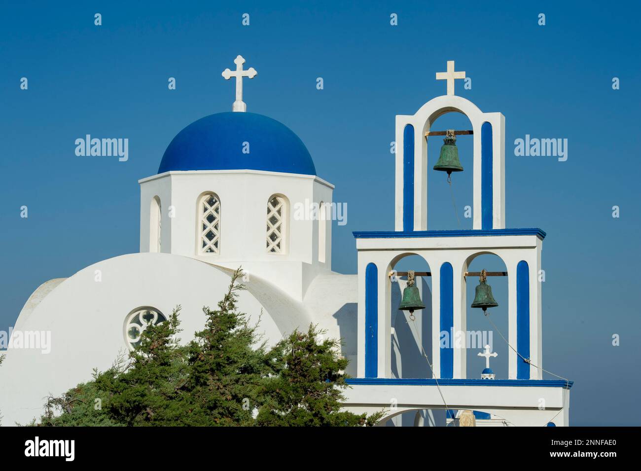 Europe, Greece, Santorini, Oia. View the classic, blue topped domed ...