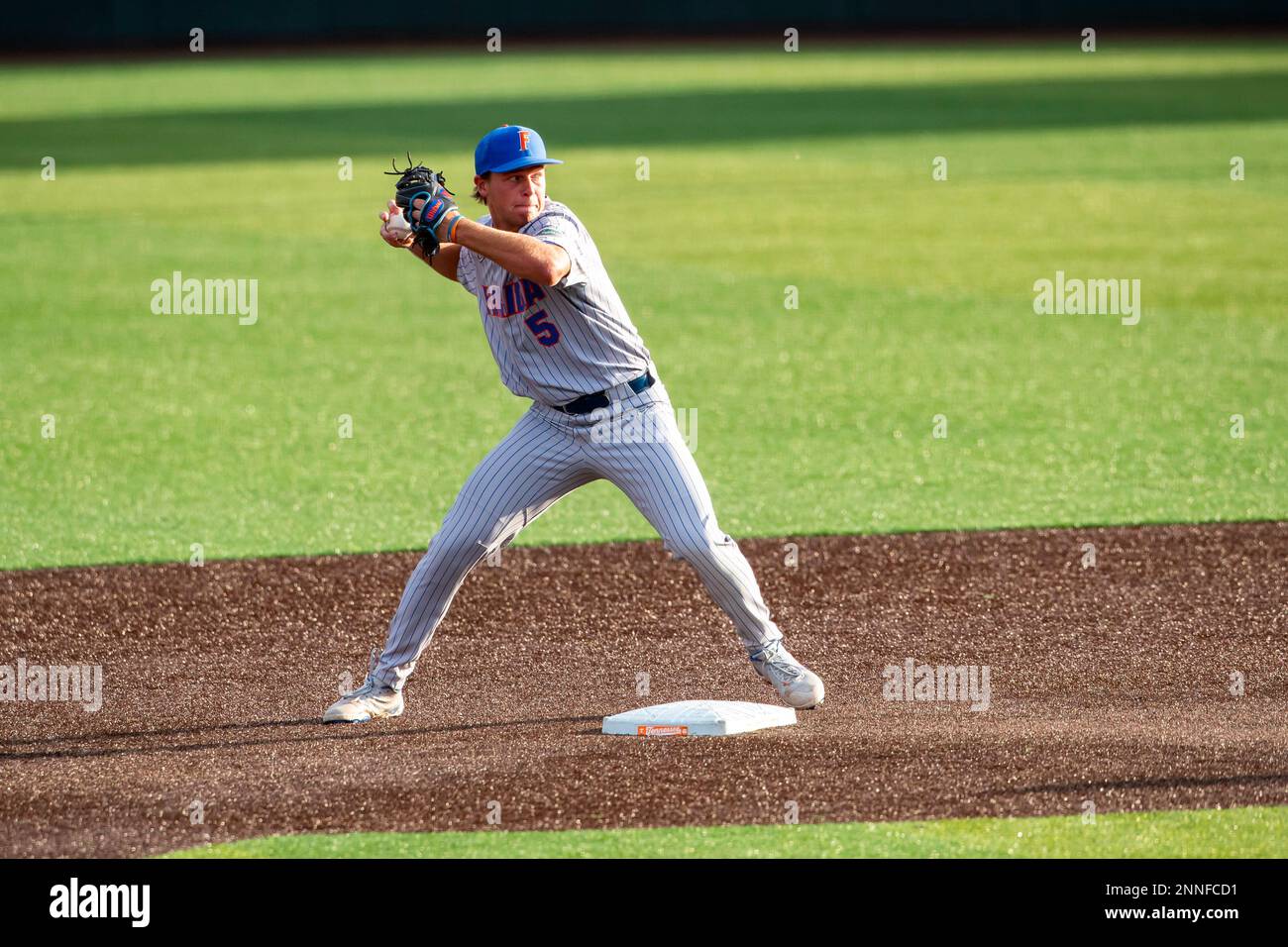 Florida Gators second baseman Colby Halter (5) makes a throw to first ...
