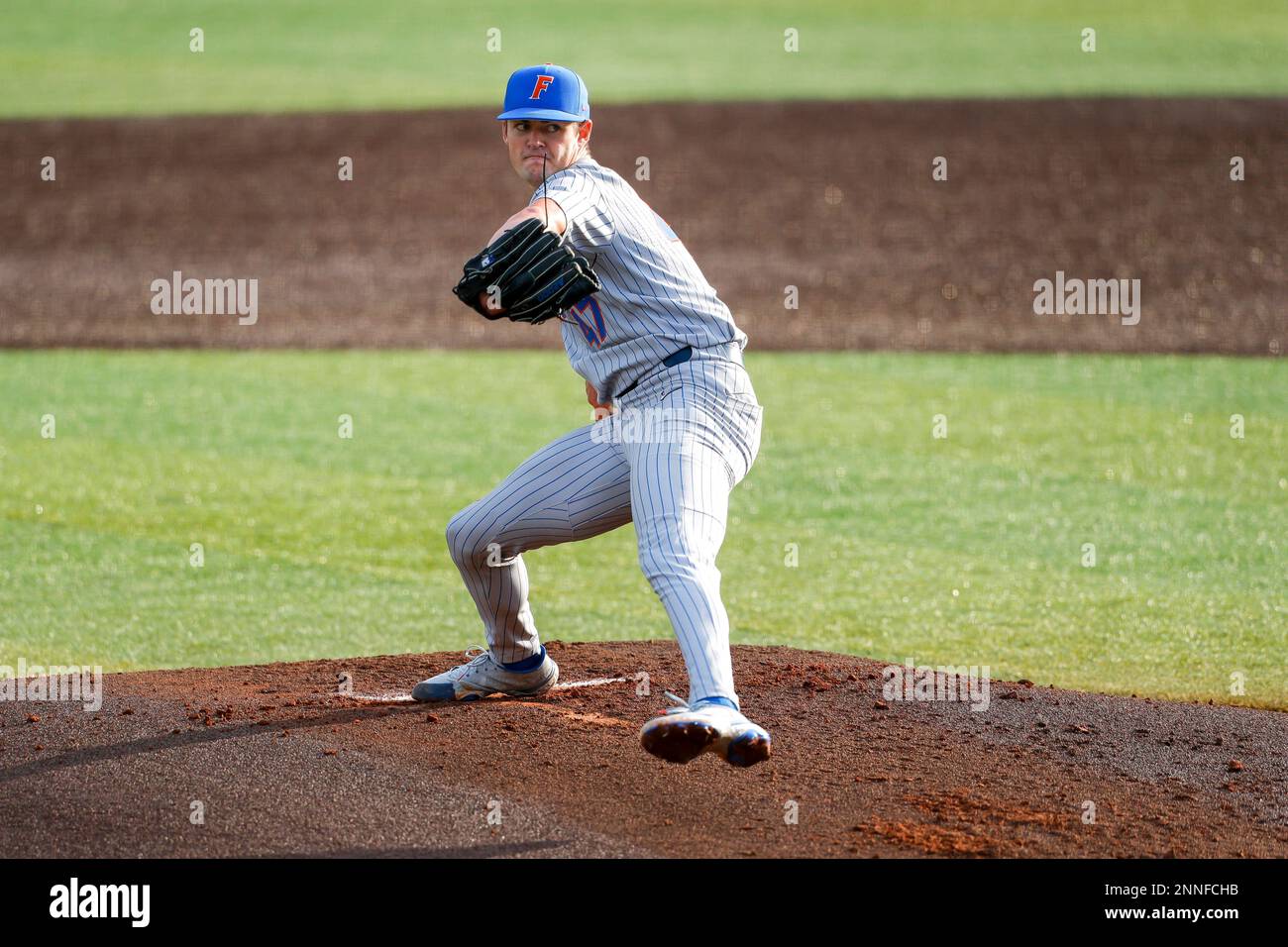 Florida Gators starting pitcher Tommy Mace (47) delivers a pitch to the ...