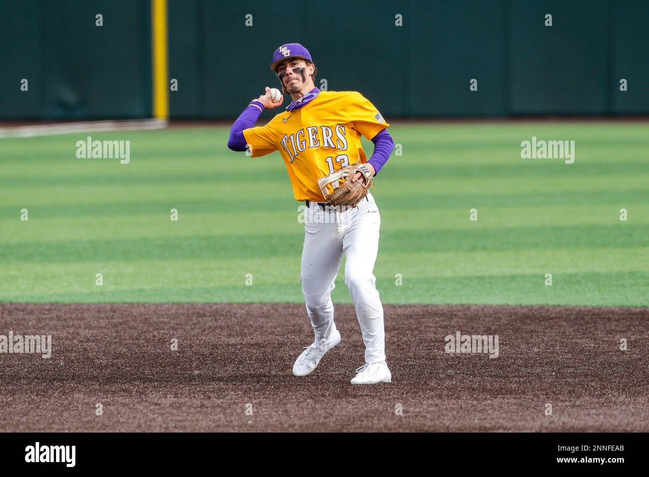 LSU Tigers shortstop Jordan Thompson (13) makes a throw to first base ...