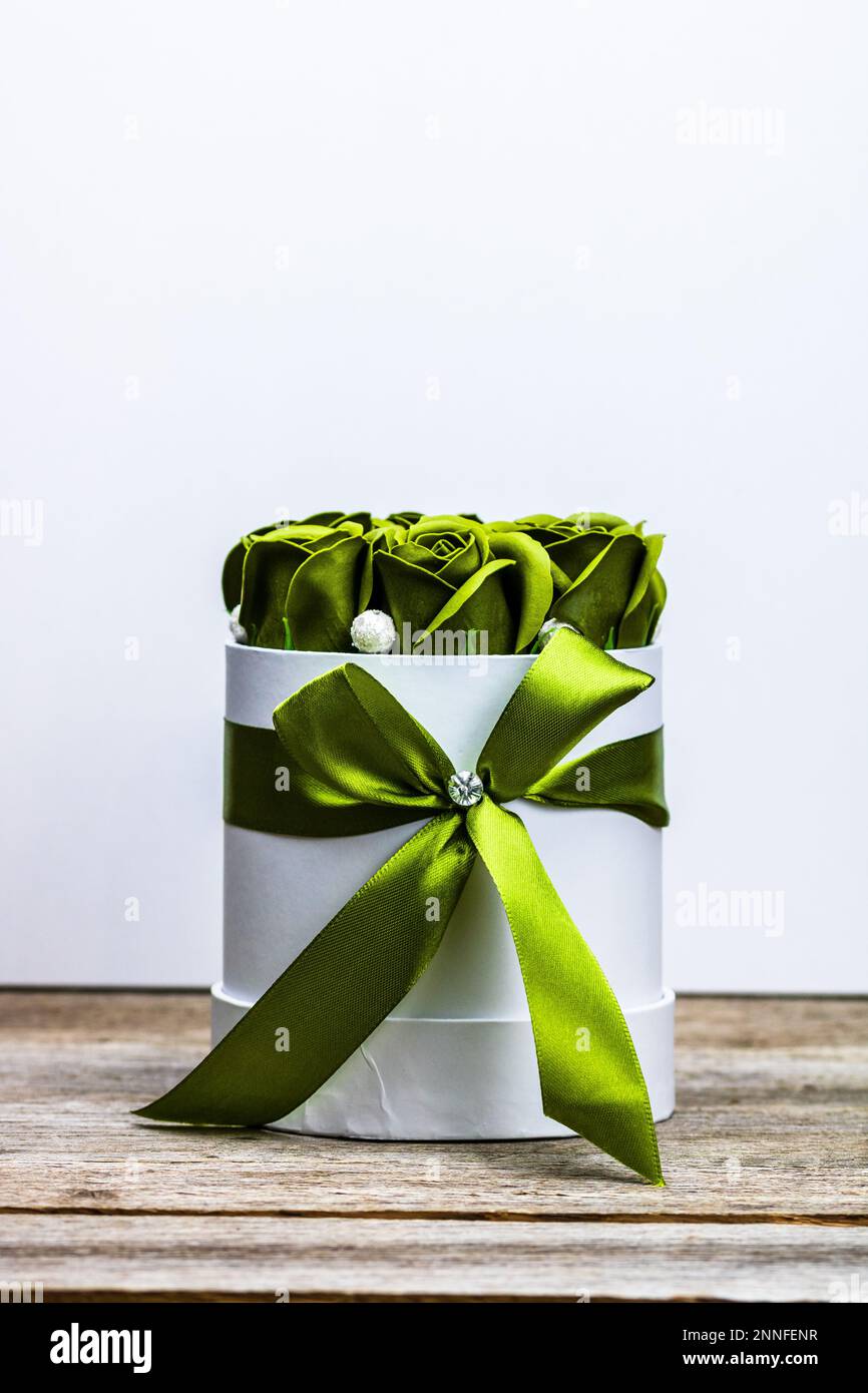 Green roses in a round luxury present box. Bouquet of flowers in a ...