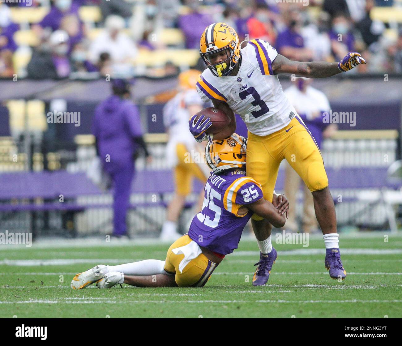 April 17, 2021: LSU's Tyrion Davis-Price (3) tries to break the tackle ...