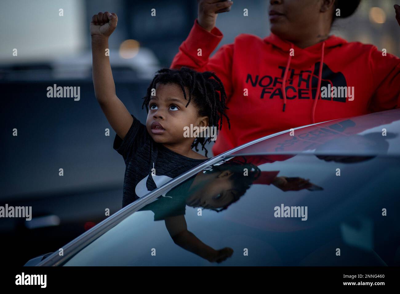 Larry Simpson Jr., 4, stands with his family, Vickey Lewis and Larry ...
