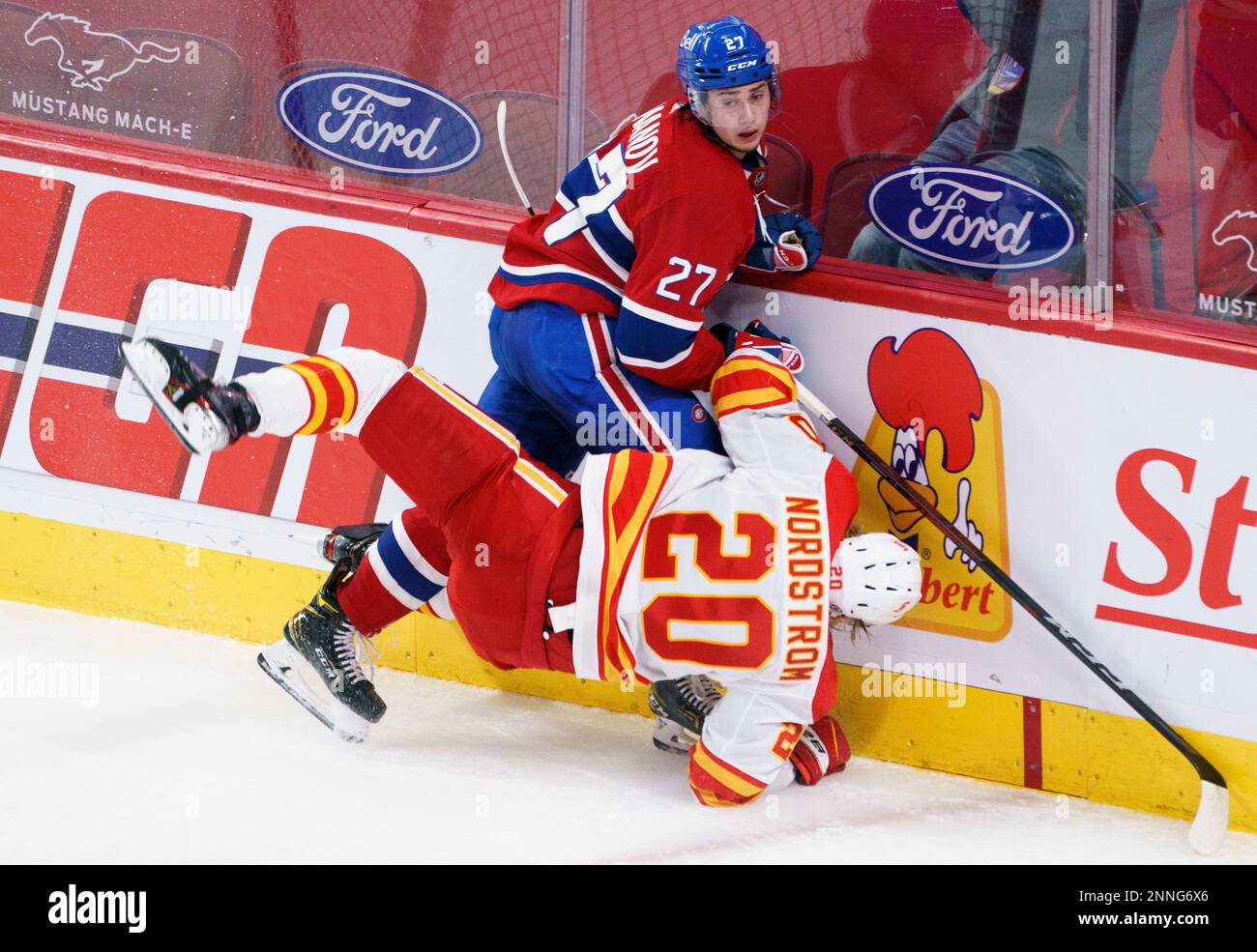 Calgary Flames' Joakim Nordstrom falls after taking a hit from Montreal ...
