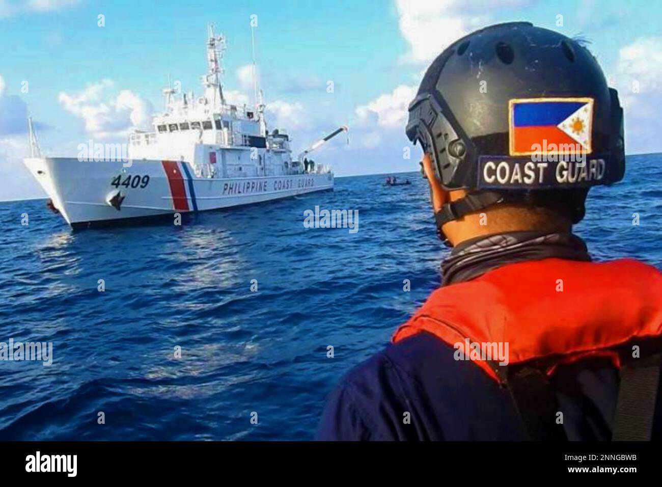 In this handout photo provided by the Philippine Coast Guard, members ...