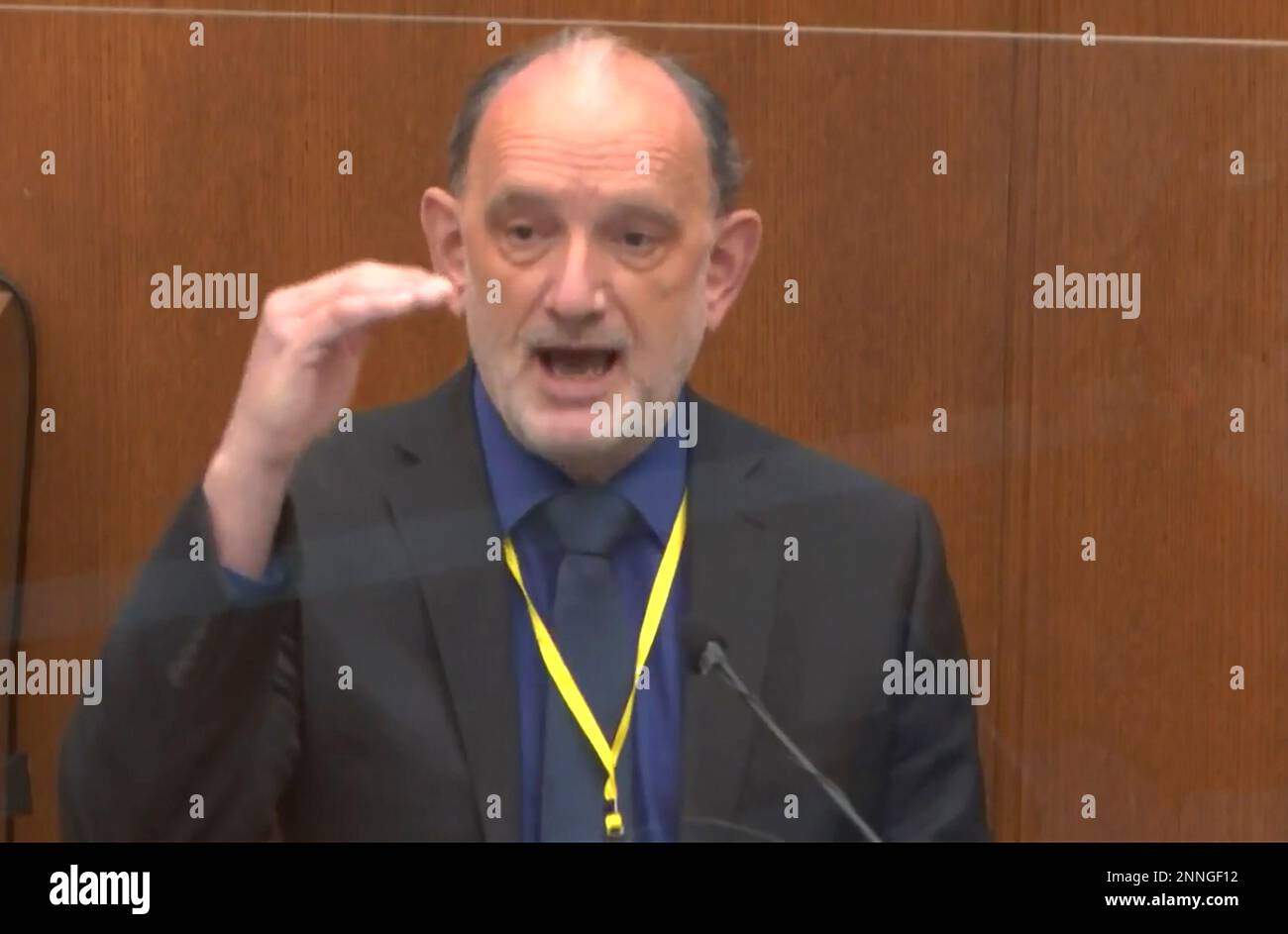 In this image from video, Dr. David Fowler testifies as Hennepin County ...