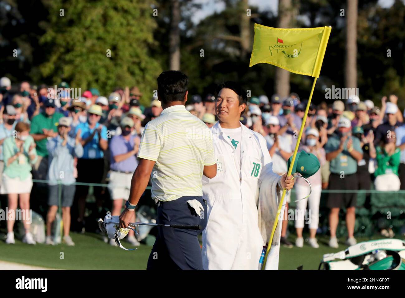 Hideki Matsuyama greets his caddie Shota Hayafuji after Matsuyama won ...