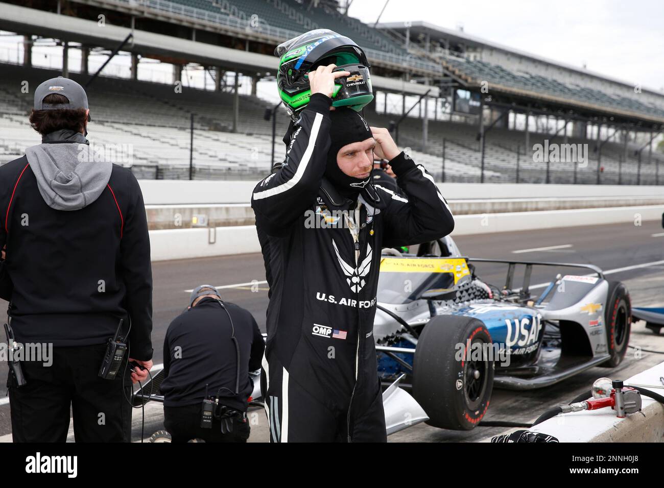 INDIANAPOLIS, IN - APRIL 9: NTT Series driver Conor Daly puts on his ...