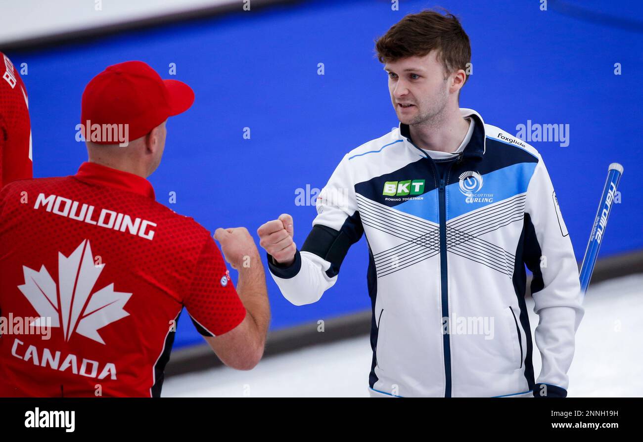 Scotland skip Bruce Mouat, right, bumps fists with Canada third Darren ...