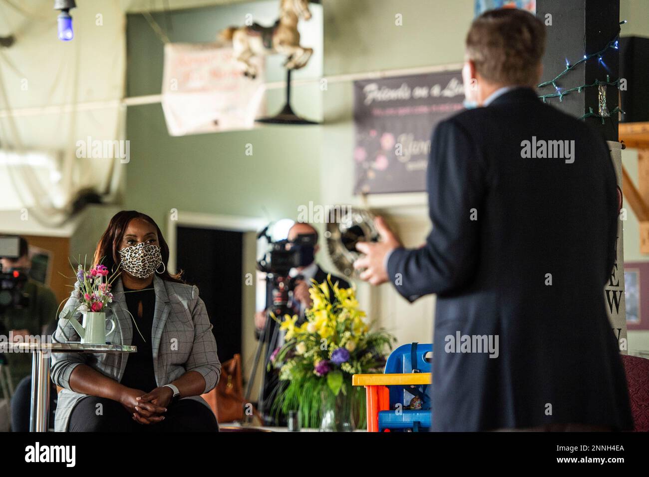 Jamesia Harrison, owner of JE Consulting LLC, listens to U.S. Sen. Mark ...