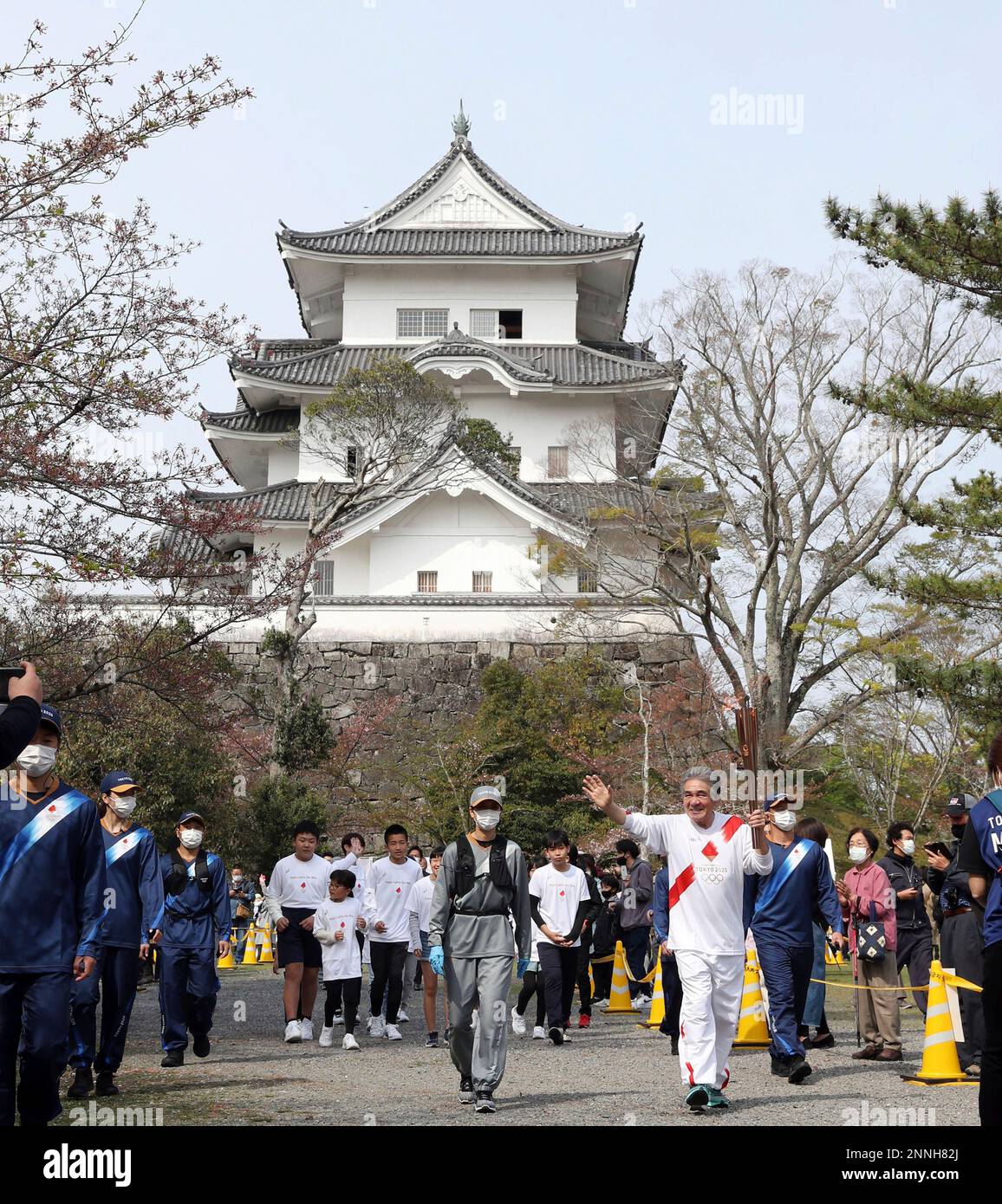 Ichiro Toba, Japanese falk singer bears a torch with Iga-Ueno Castle in ...
