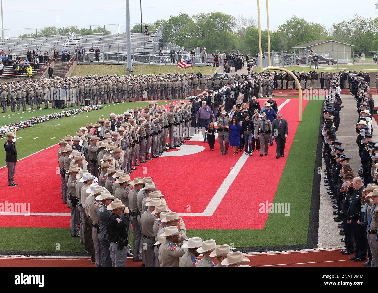 Law enforment officers form a line of honor as Texas Department of ...