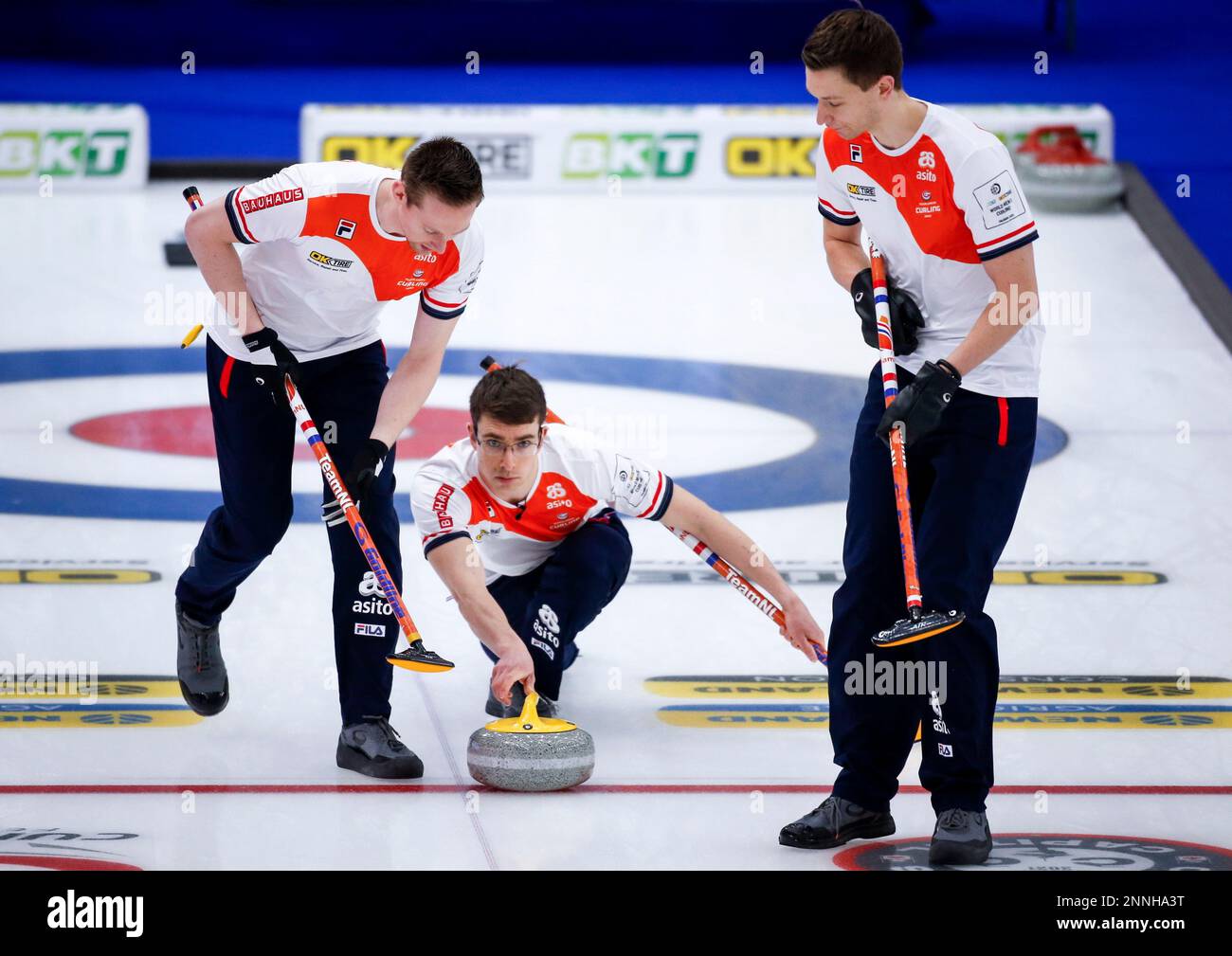 Netherlands skip Jaap van Dorp, center, makes a shot as lead Carlo ...