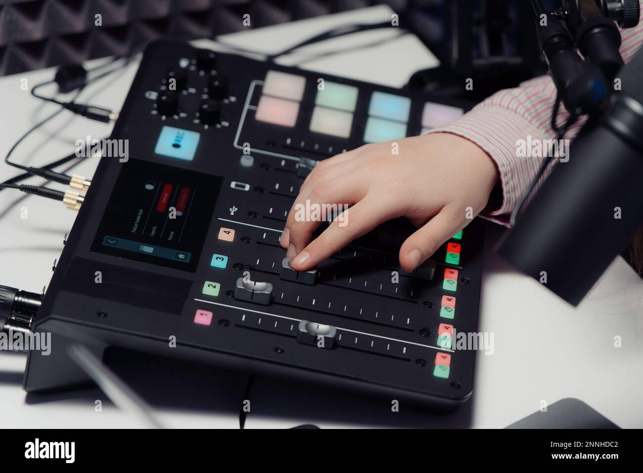 Radio host using mixing console Stock Photo - Alamy