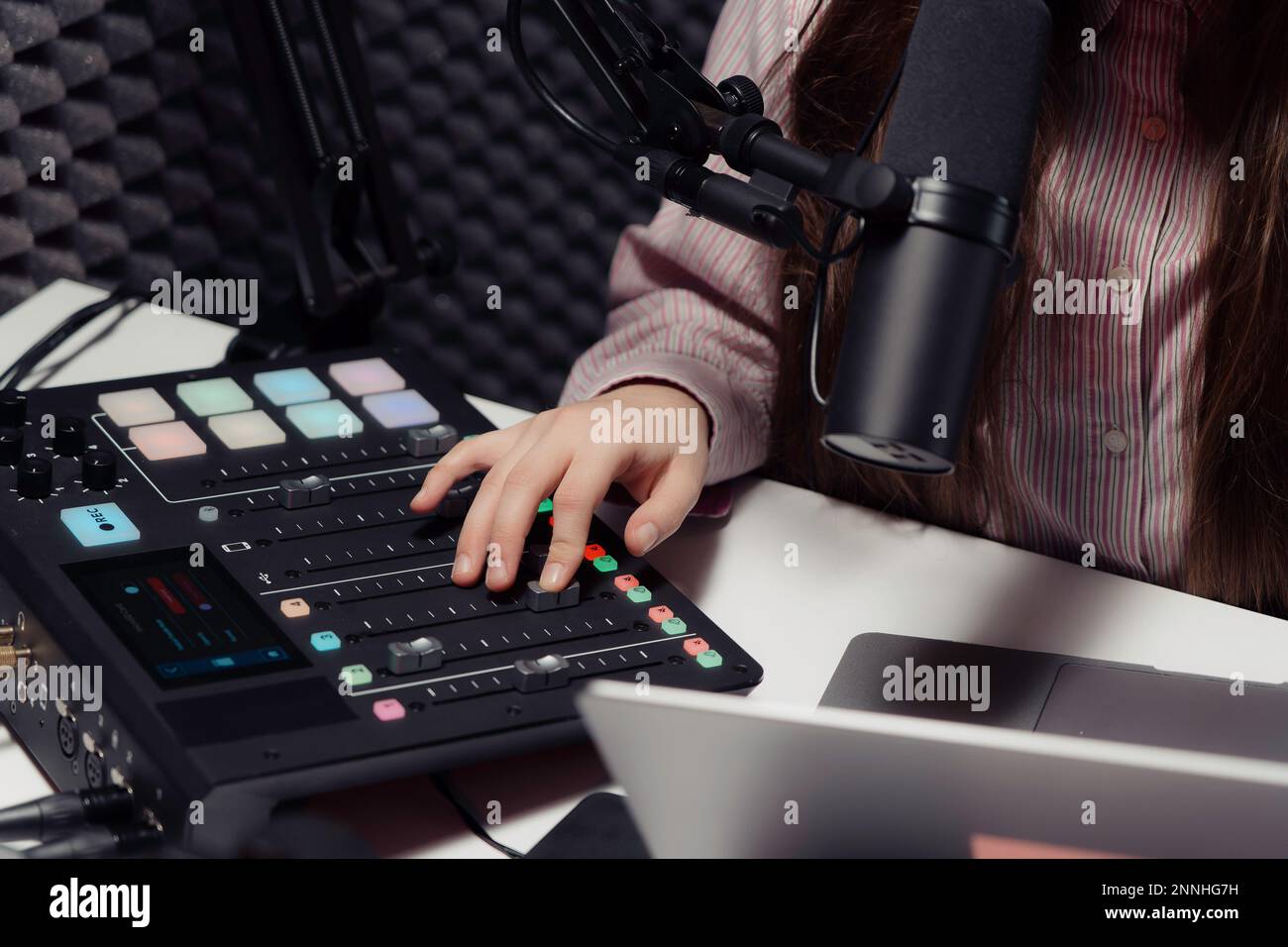 Radio host using mixing console Stock Photo - Alamy