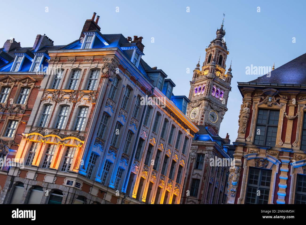 Antique renaissance buildings and the belfry of the Chamber of Commerce ...