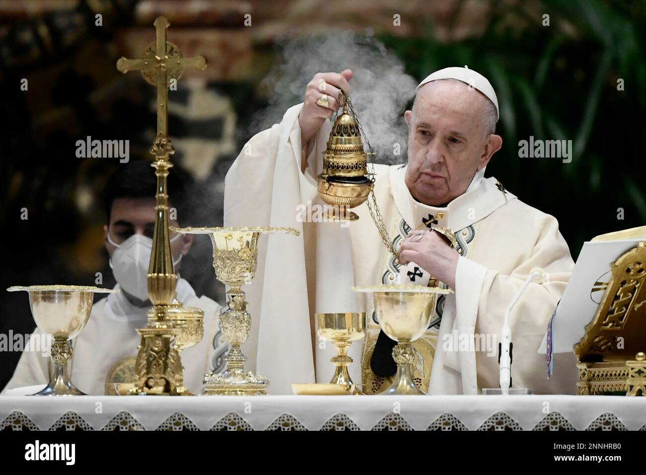 Pope Francis swings a thurible of incense as he prepares to celebrate ...