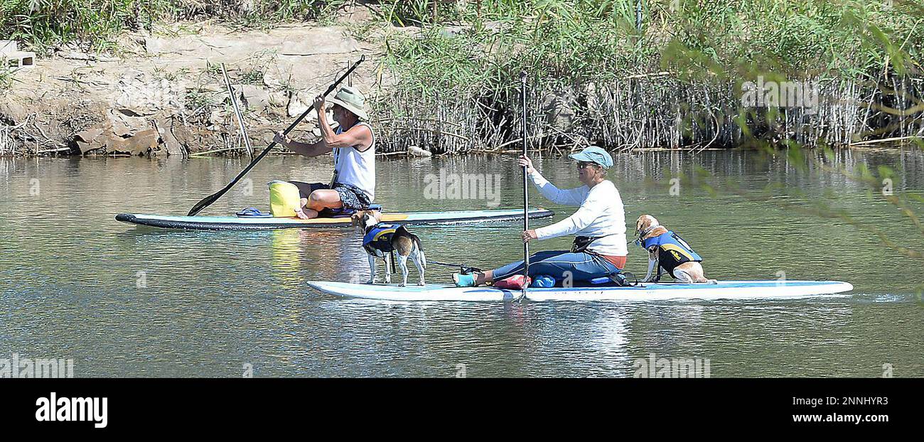 A couple cruise down the Colorado River past Playa Linda at West ...