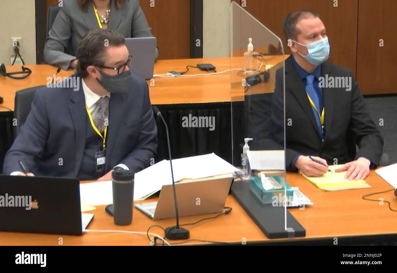 In this image from video, defense attorney Eric Nelson, left, and ...