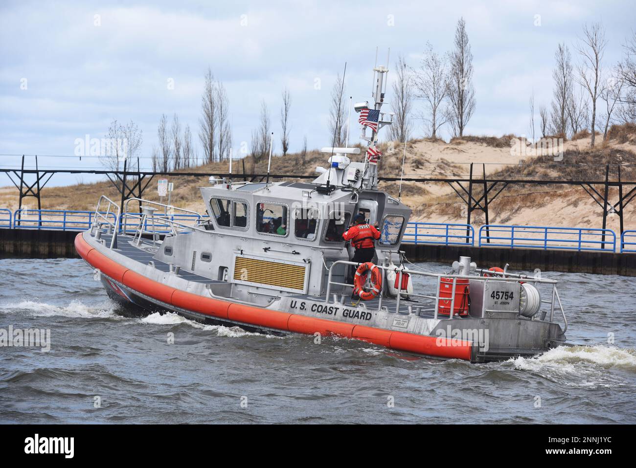 A U.S. Coast Guard vessel makes its way into Lake Michigan Thursday ...