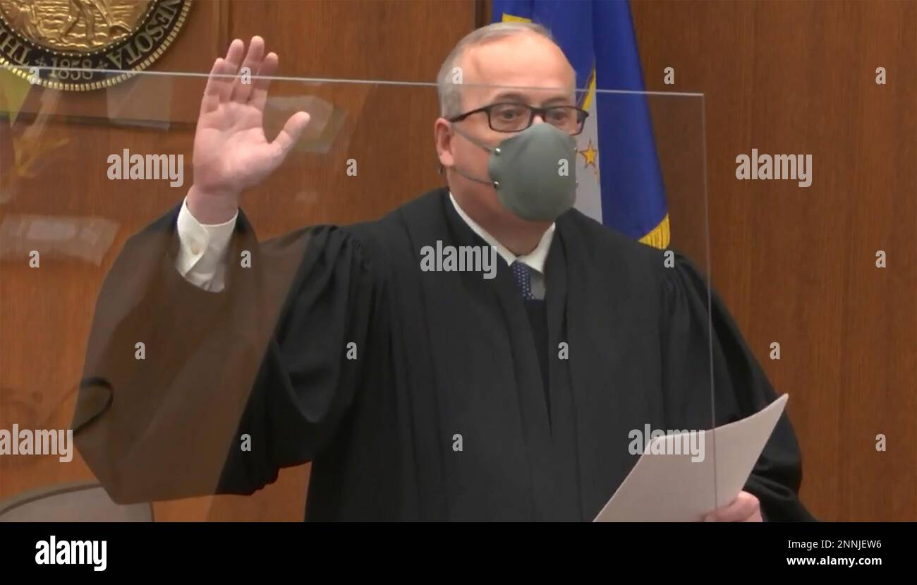 In this image from video, Hennepin County Judge PeterCahill swears in ...