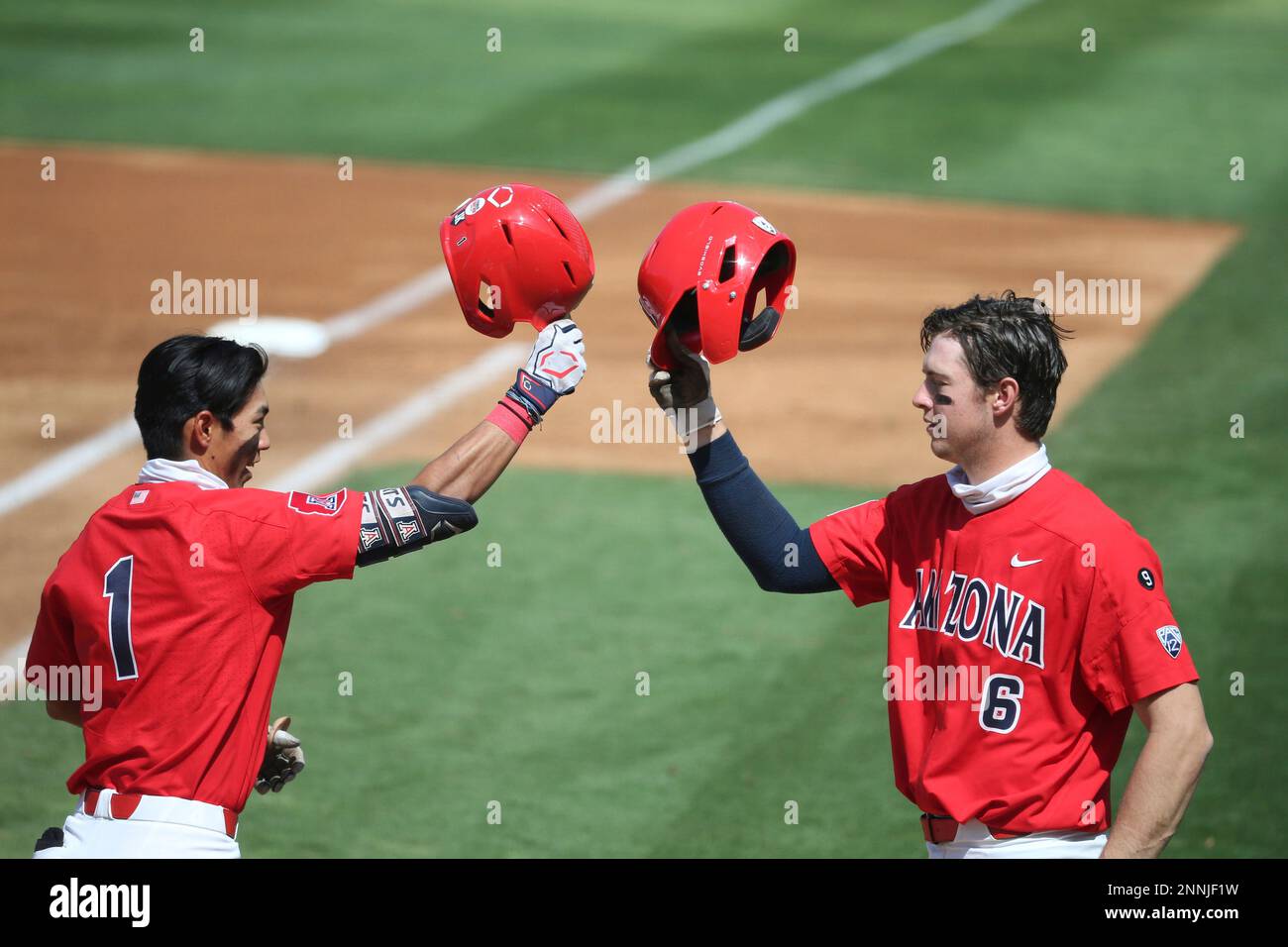 Kobe Kato (1) and Daniel Susac (6) of the Arizona Wildcats celebrate ...