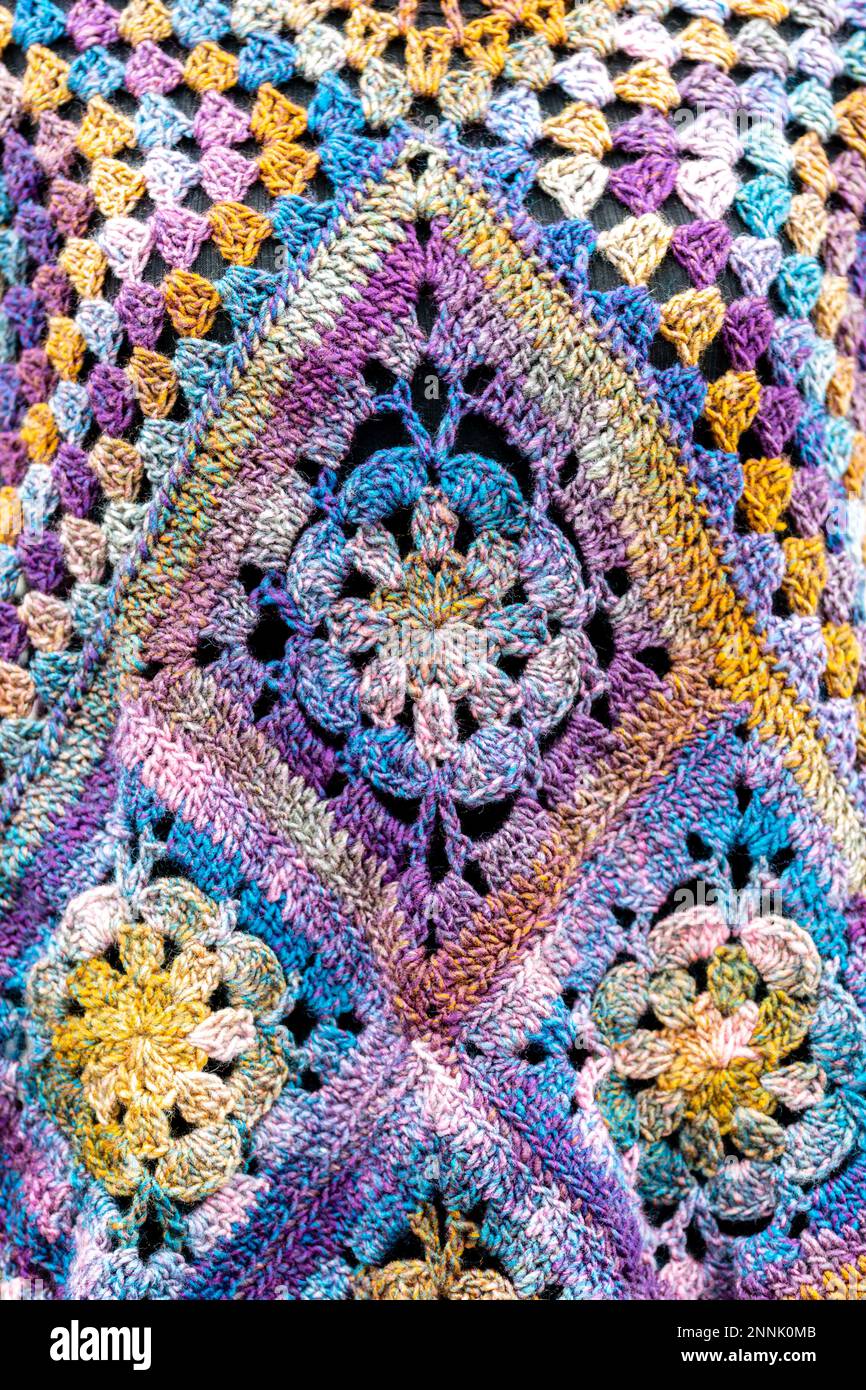 Background. Multicolored knitted handmade cloth pattern. Knitted ...