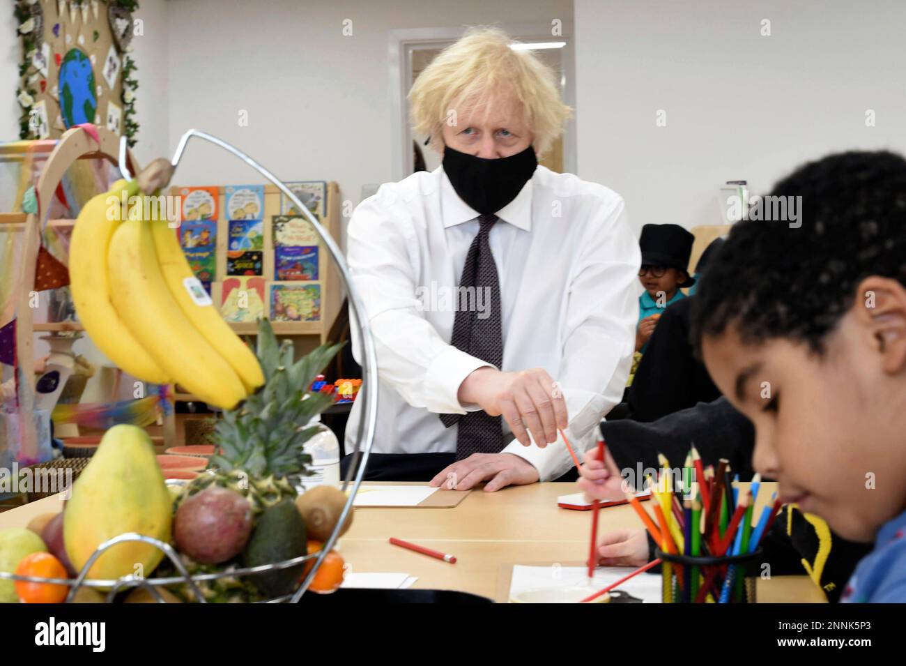 Prime Minister Boris Johnson prepare to draw of a bunch of bananas ...