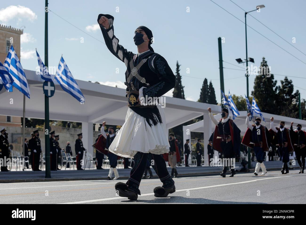 Members of the Greek army march with traditional costumes during a ...