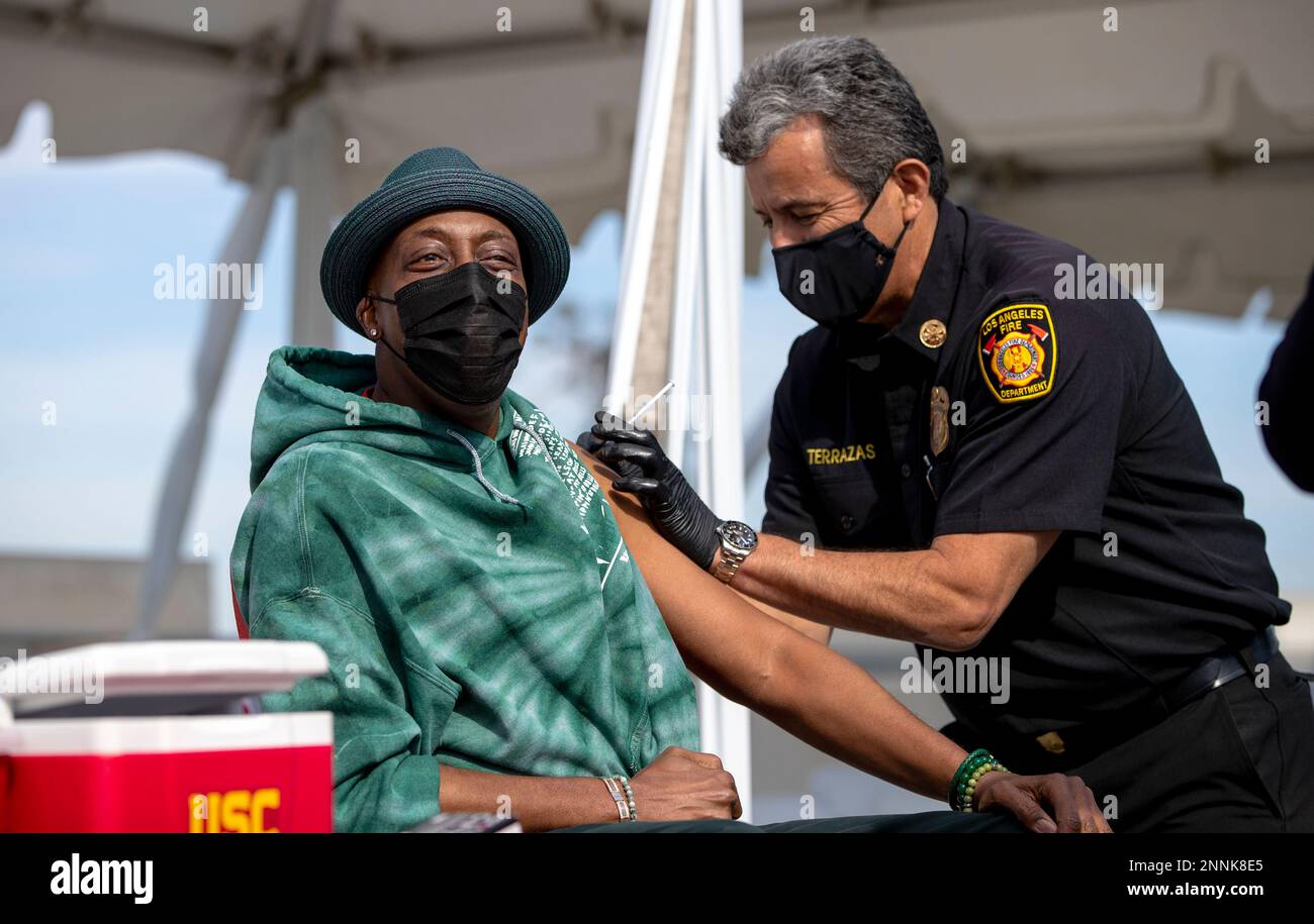 Los Angeles Fire Department Chief Ralph Terrazas gives a vaccine shot ...