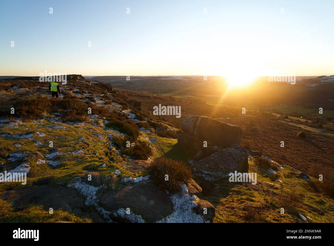 A man picking up litter in the Peak District, along Baslow Edge at ...