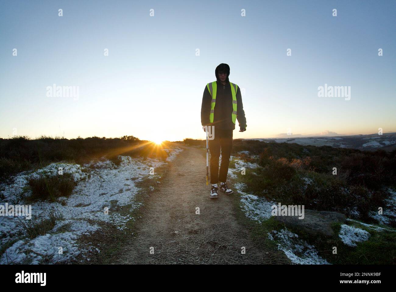 A man picking up litter in the Peak District, along Baslow Edge at ...