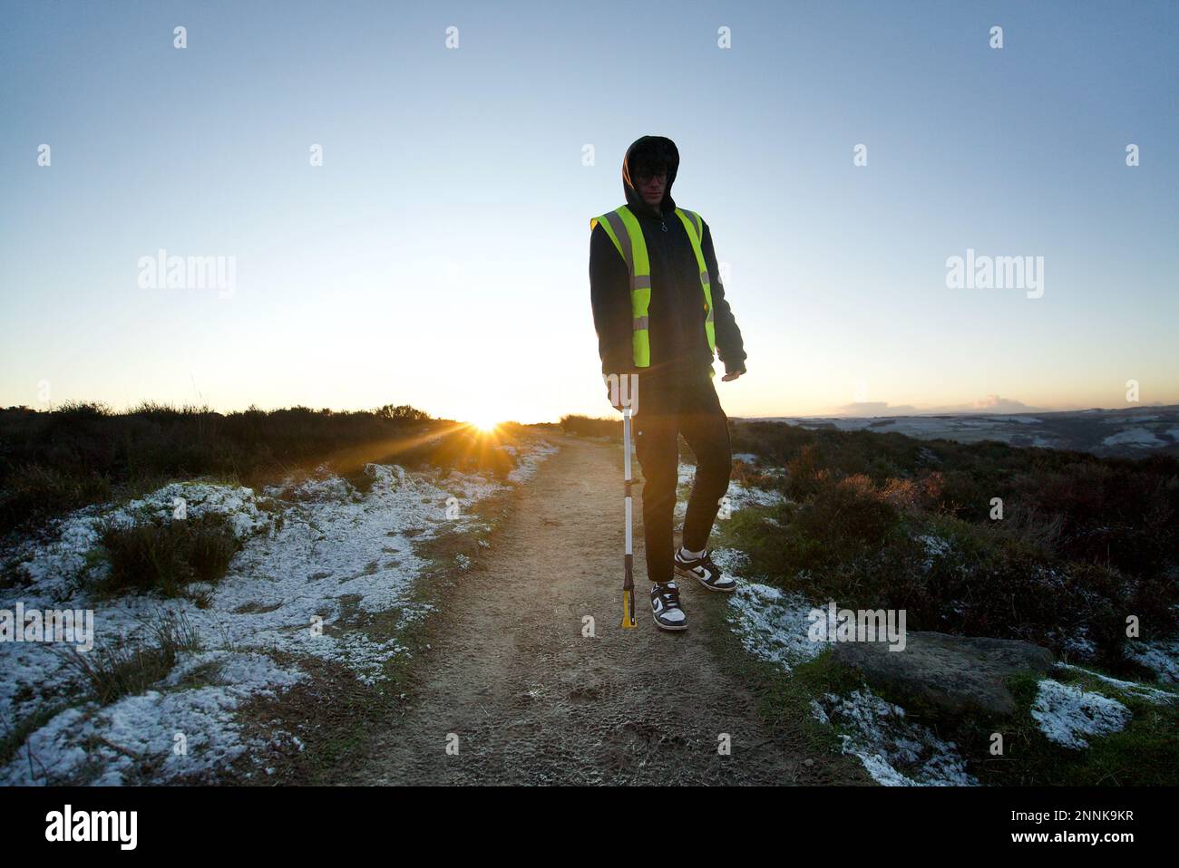 A man picking up litter in the Peak District, along Baslow Edge at ...
